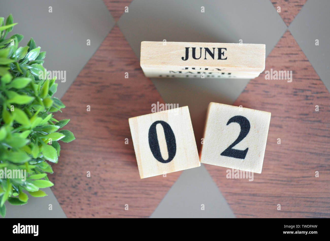 Date of June with leaf on diamond pattern table for background Stock ...