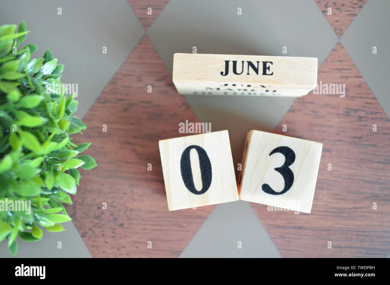 Date of June with leaf on diamond pattern table for background Stock ...