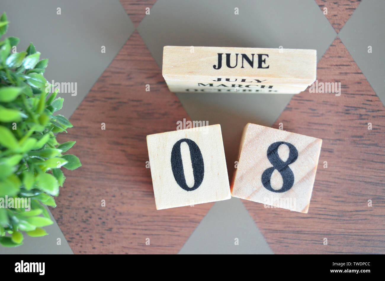 Date of June with leaf on diamond pattern table for background Stock ...