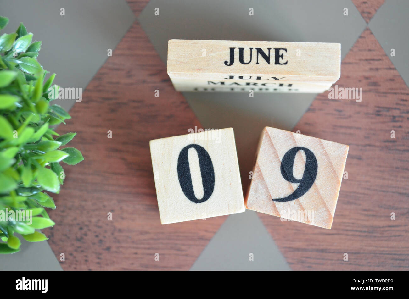 Date of June with leaf on diamond pattern table for background Stock ...