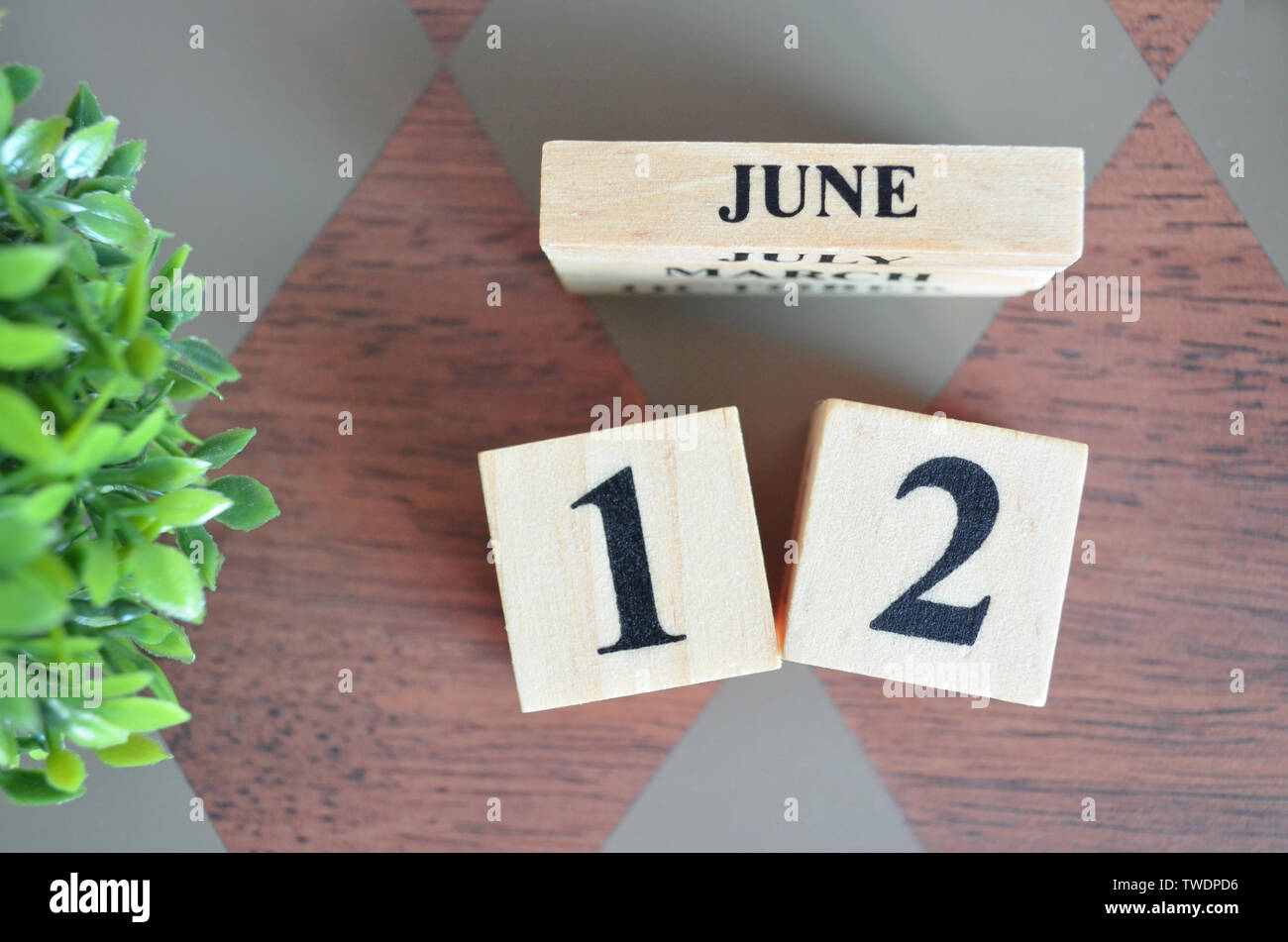 Date of June with leaf on diamond pattern table for background Stock ...