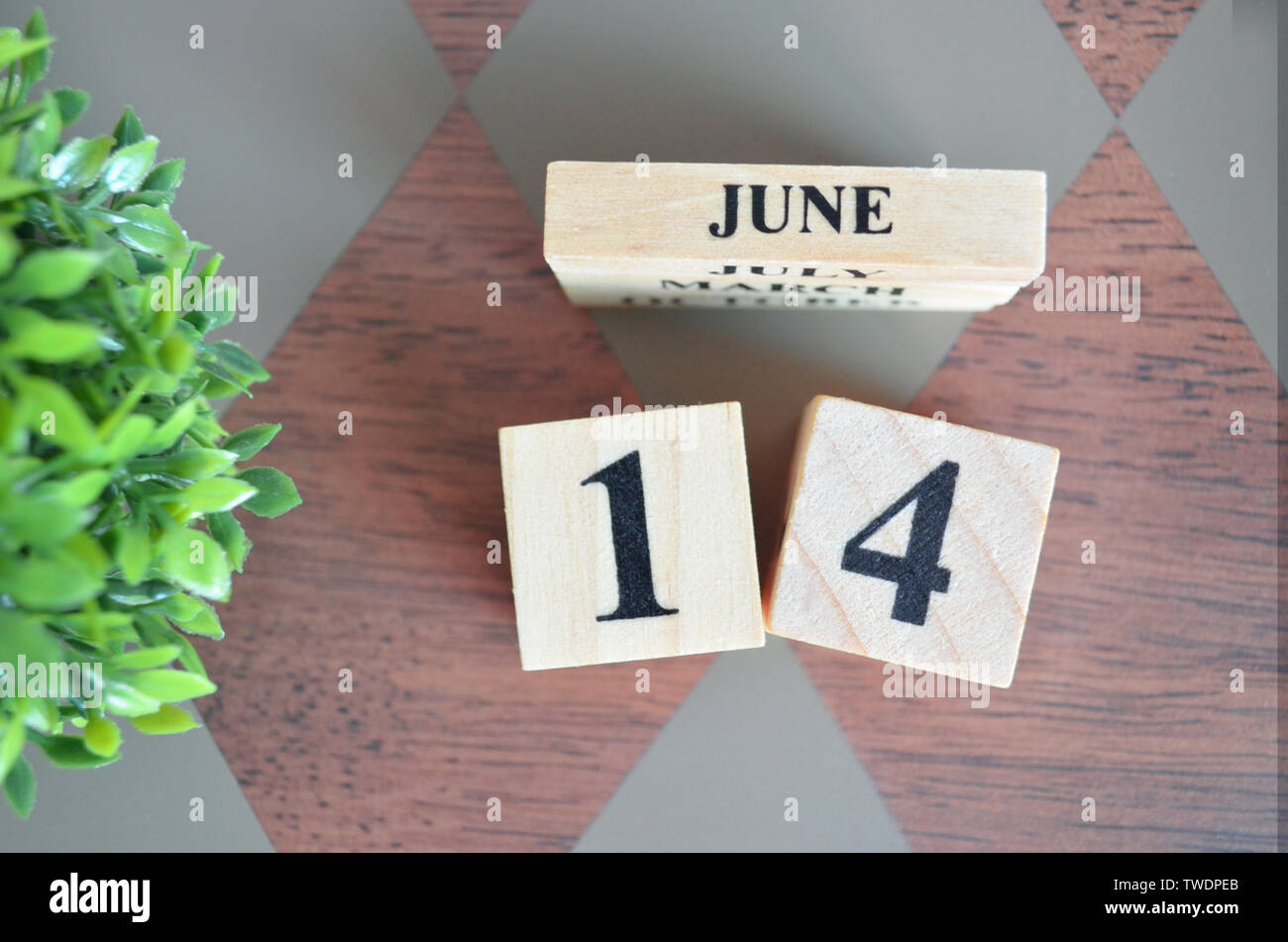 Date of June with leaf on diamond pattern table for background Stock ...