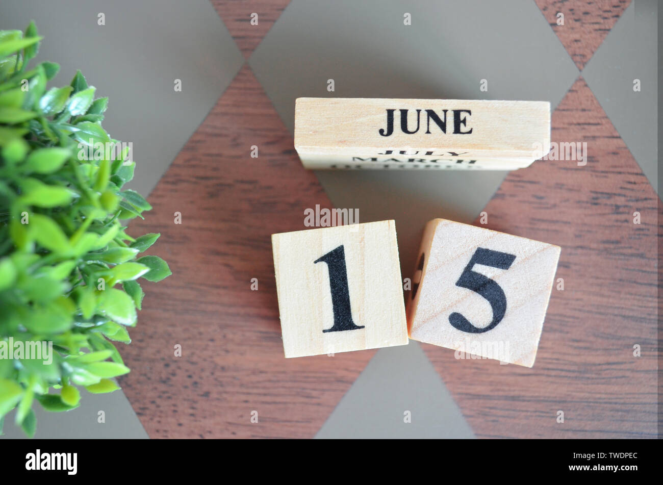 Date of June with leaf on diamond pattern table for background Stock ...