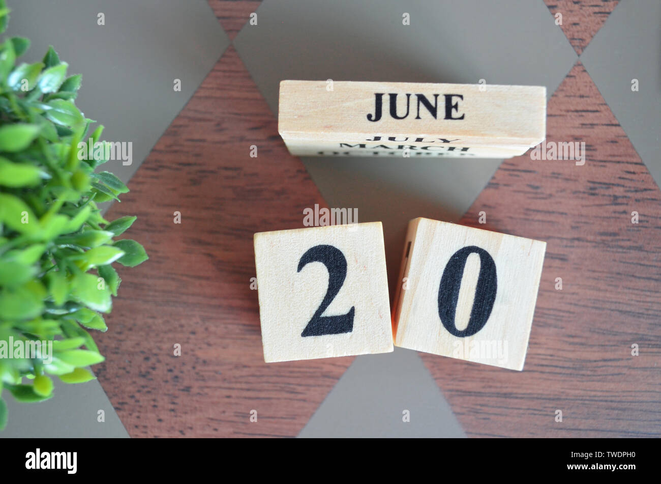 Date of June with leaf on diamond pattern table for background Stock ...