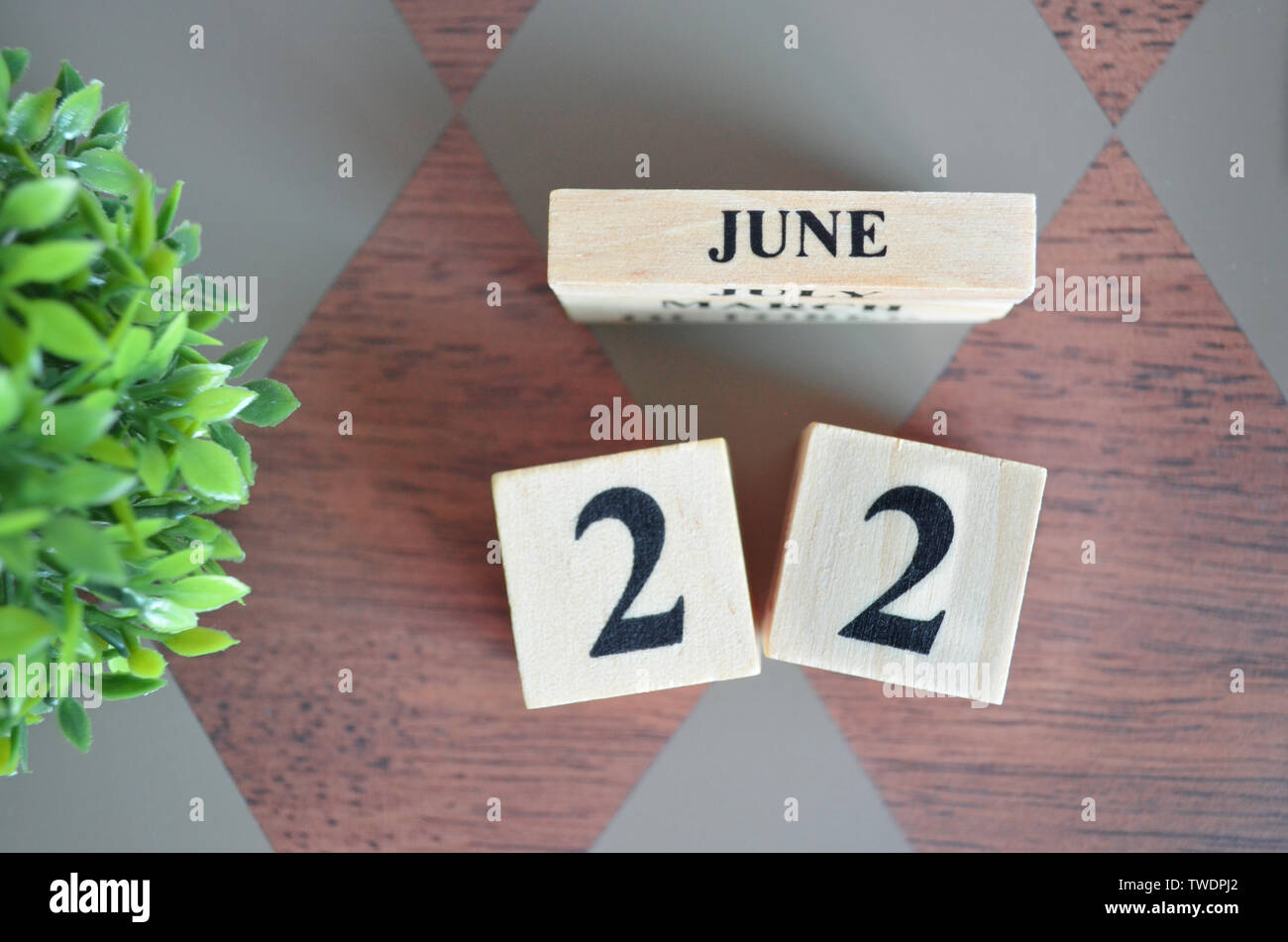 Date of June with leaf on diamond pattern table for background Stock ...
