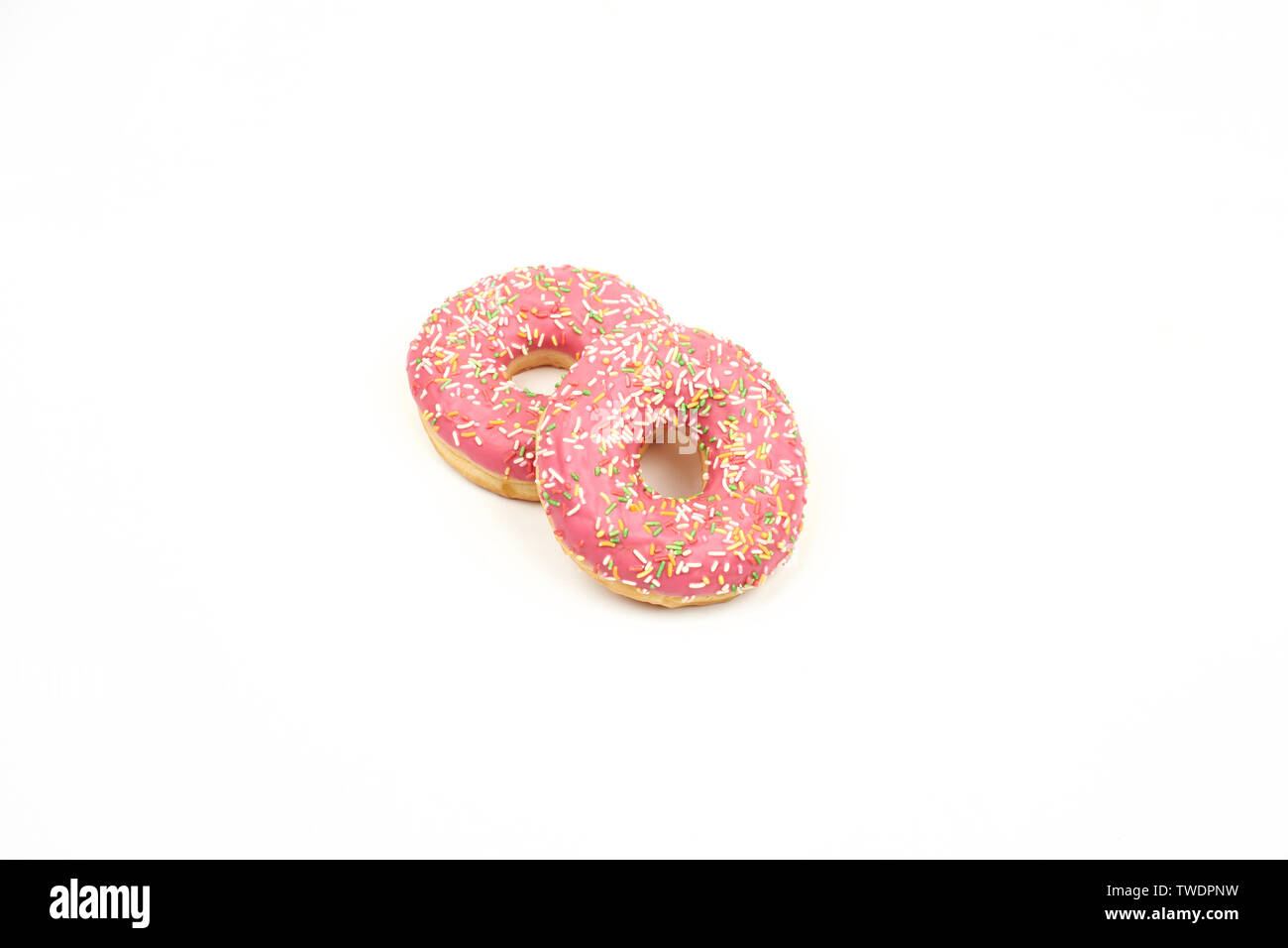 Pink donut with colorful sprinkles isolated on white background Stock ...