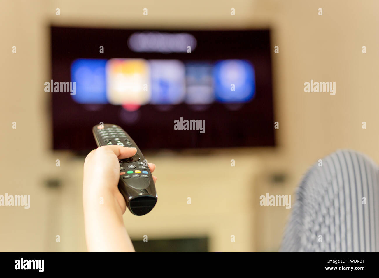 Hand using remote controller for watching television at home Stock ...