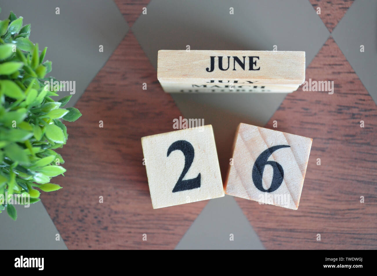 Date of June with leaf on diamond pattern table for background Stock ...