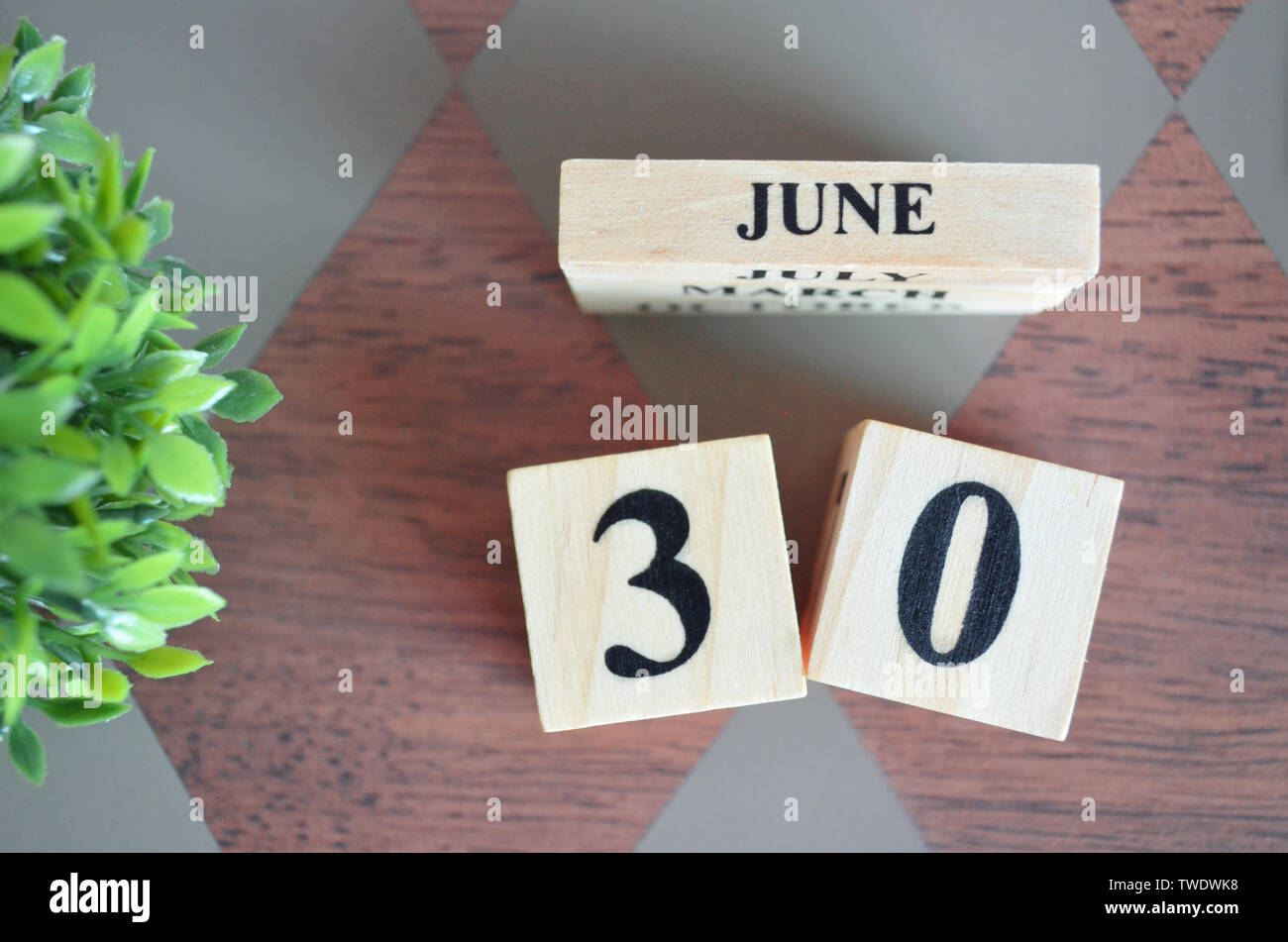 Date of June with leaf on diamond pattern table for background Stock ...