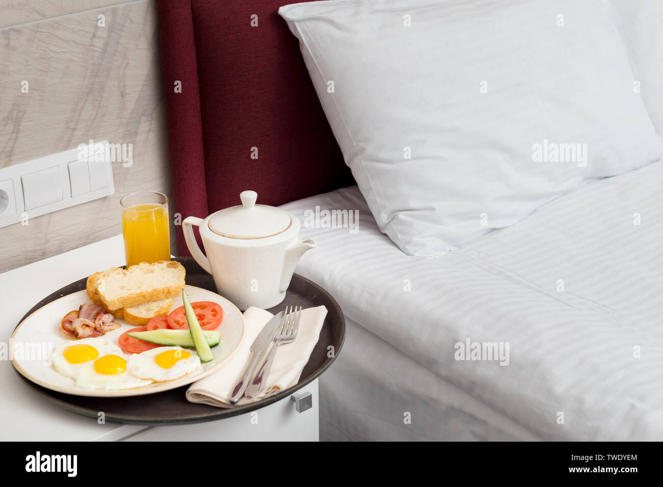 Breakfast in bed in hotel room Stock Photo - Alamy