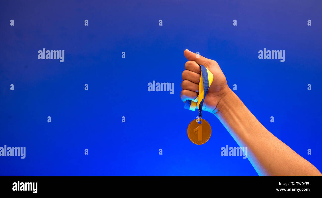 1st position award Ribbon in hand, banner background Stock Photo - Alamy