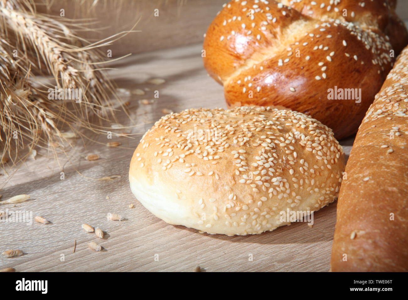 sesame bun close up, composition with loaves of bread and rolls Stock ...