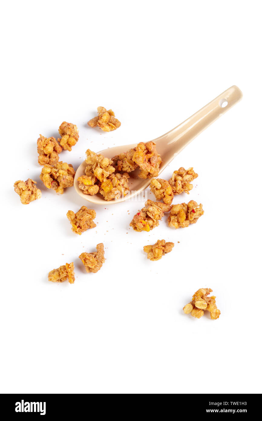 Spoon with granola on white background Stock Photo - Alamy