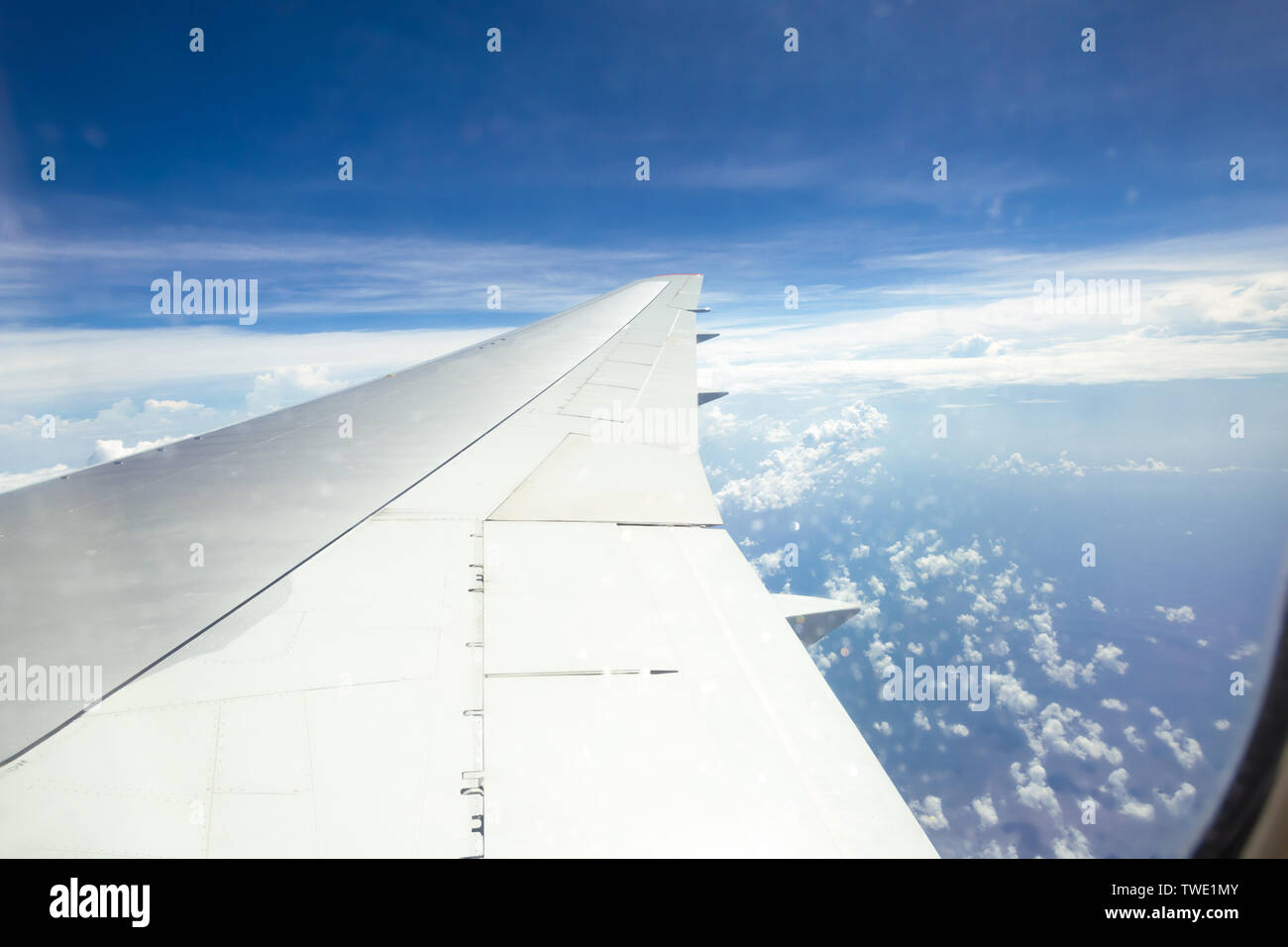 Wing of airplane from window Stock Photo - Alamy