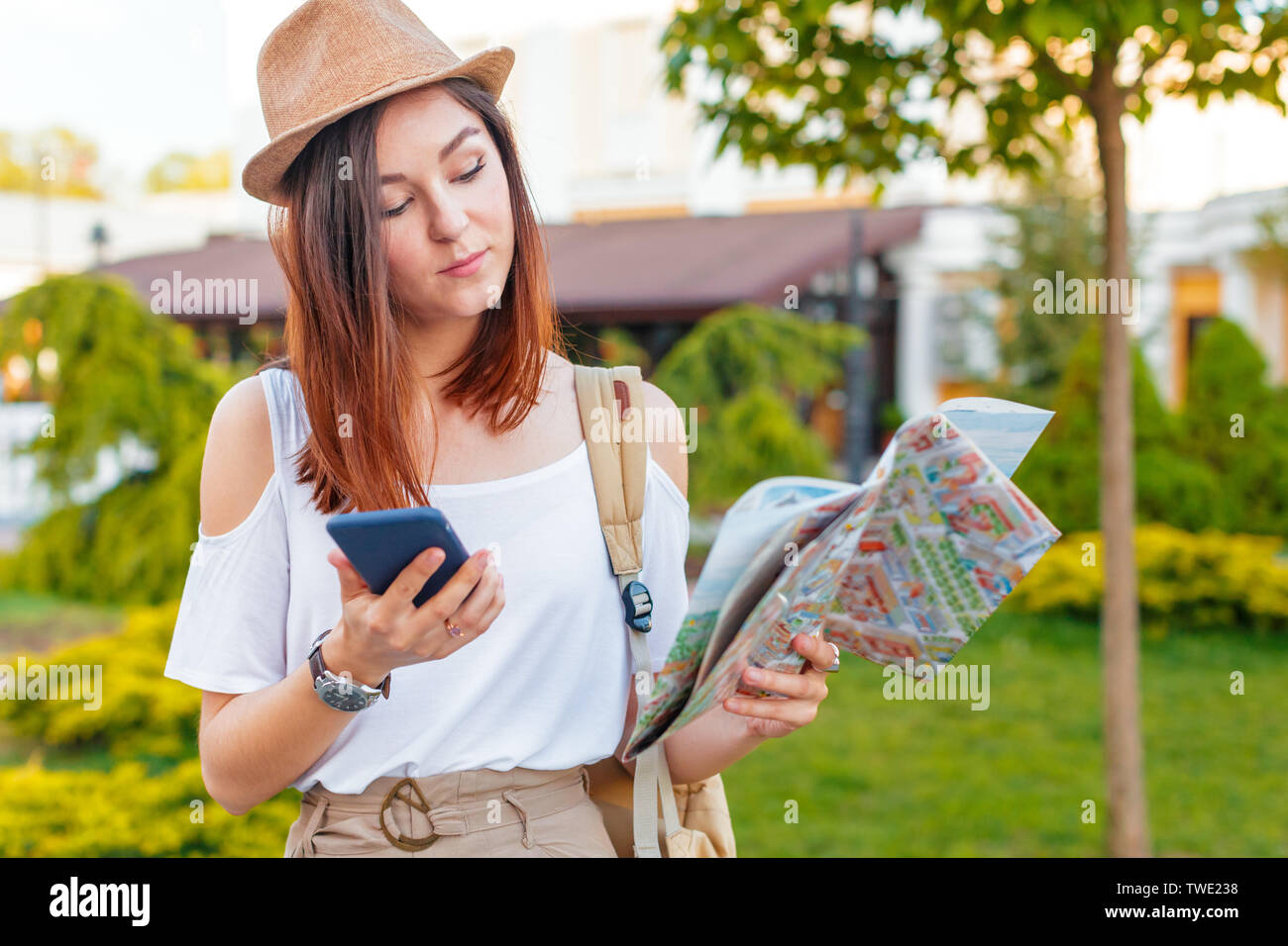 travel guide, tourism in Europe, woman tourist with map on the street ...