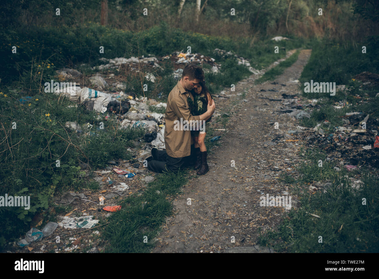 Homeless father and daughter are in garbage dump. The concept of ...