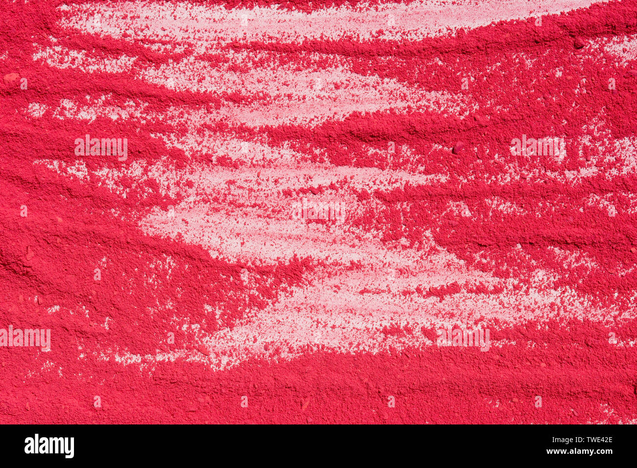 red powder pigment pattern background macro Stock Photo - Alamy