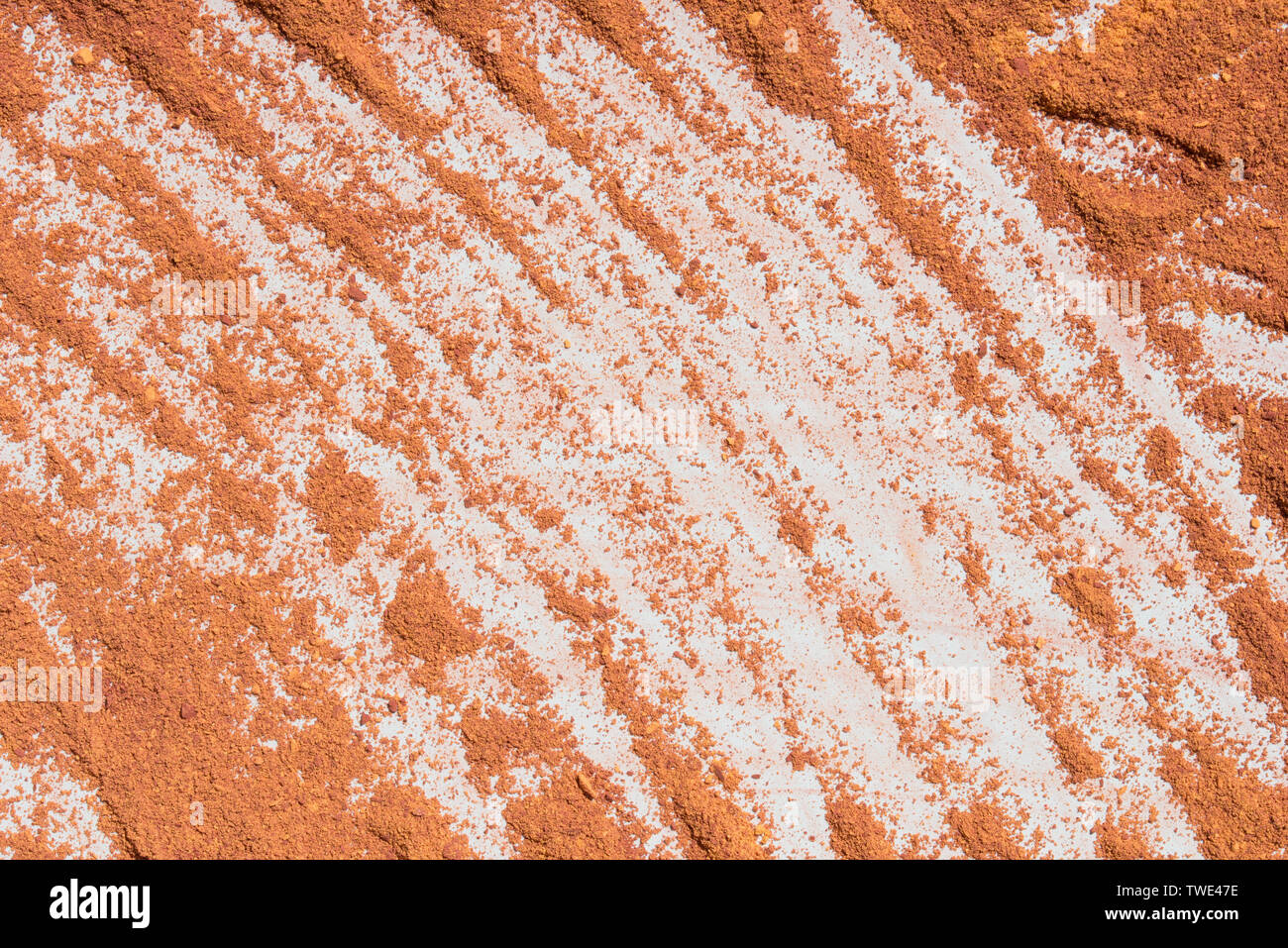 orange powder pigment pattern background macro Stock Photo - Alamy