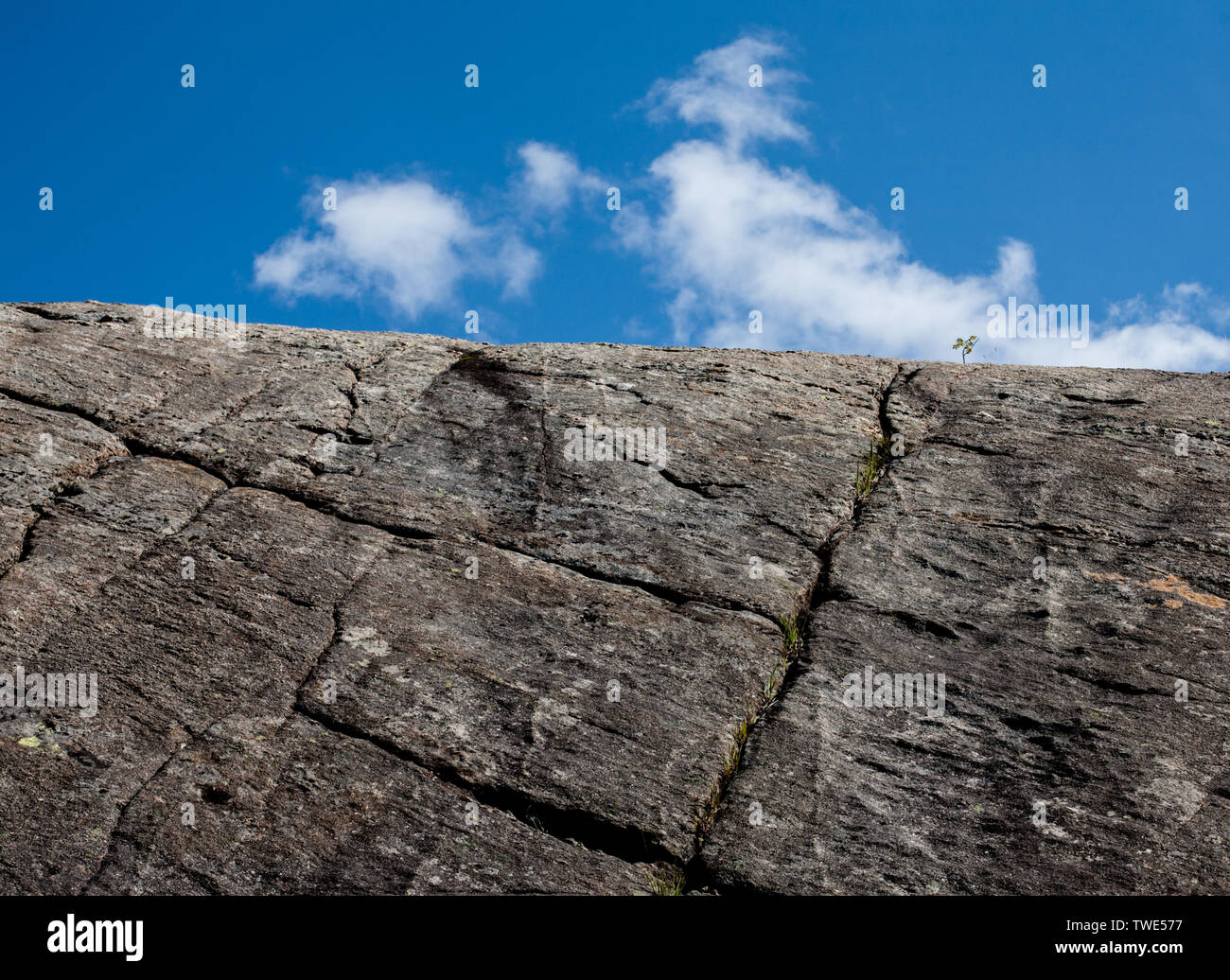 bright blue sky and stone rock wall closeup concept view Stock Photo ...