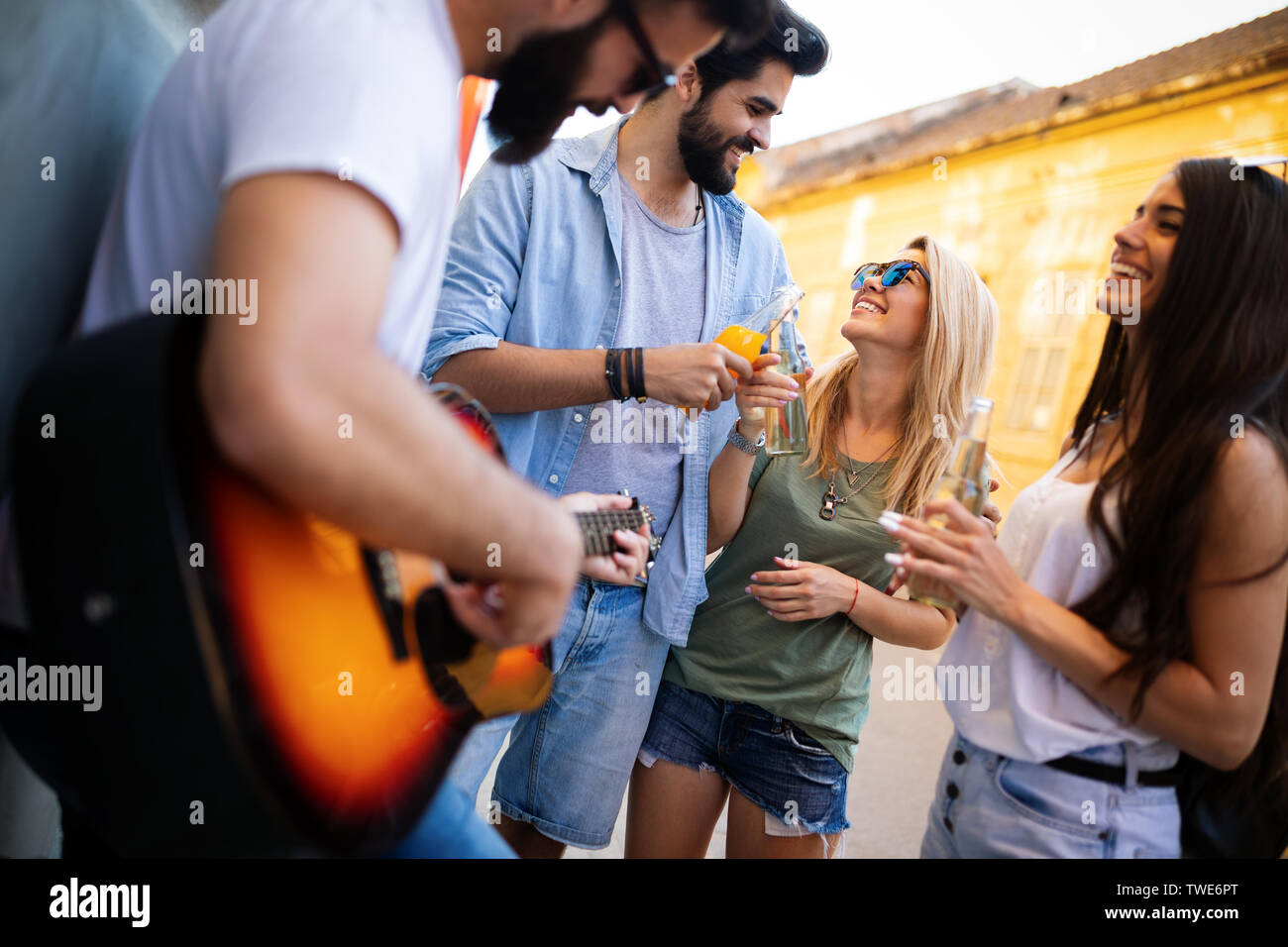Group of friends hanging out, having fun and enjoying summer days Stock ...