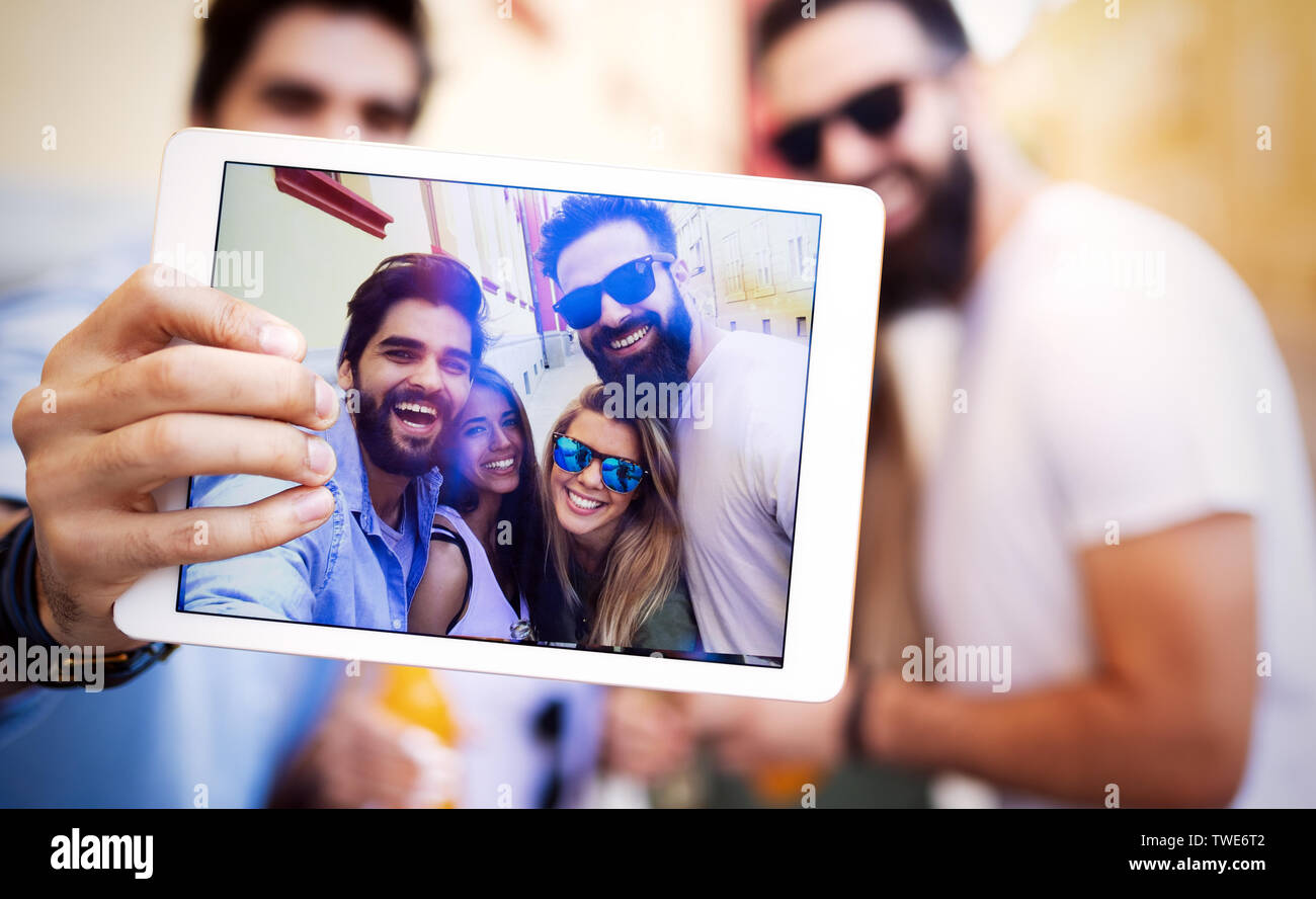 Group of young people smiling, talking and having fun together Stock ...