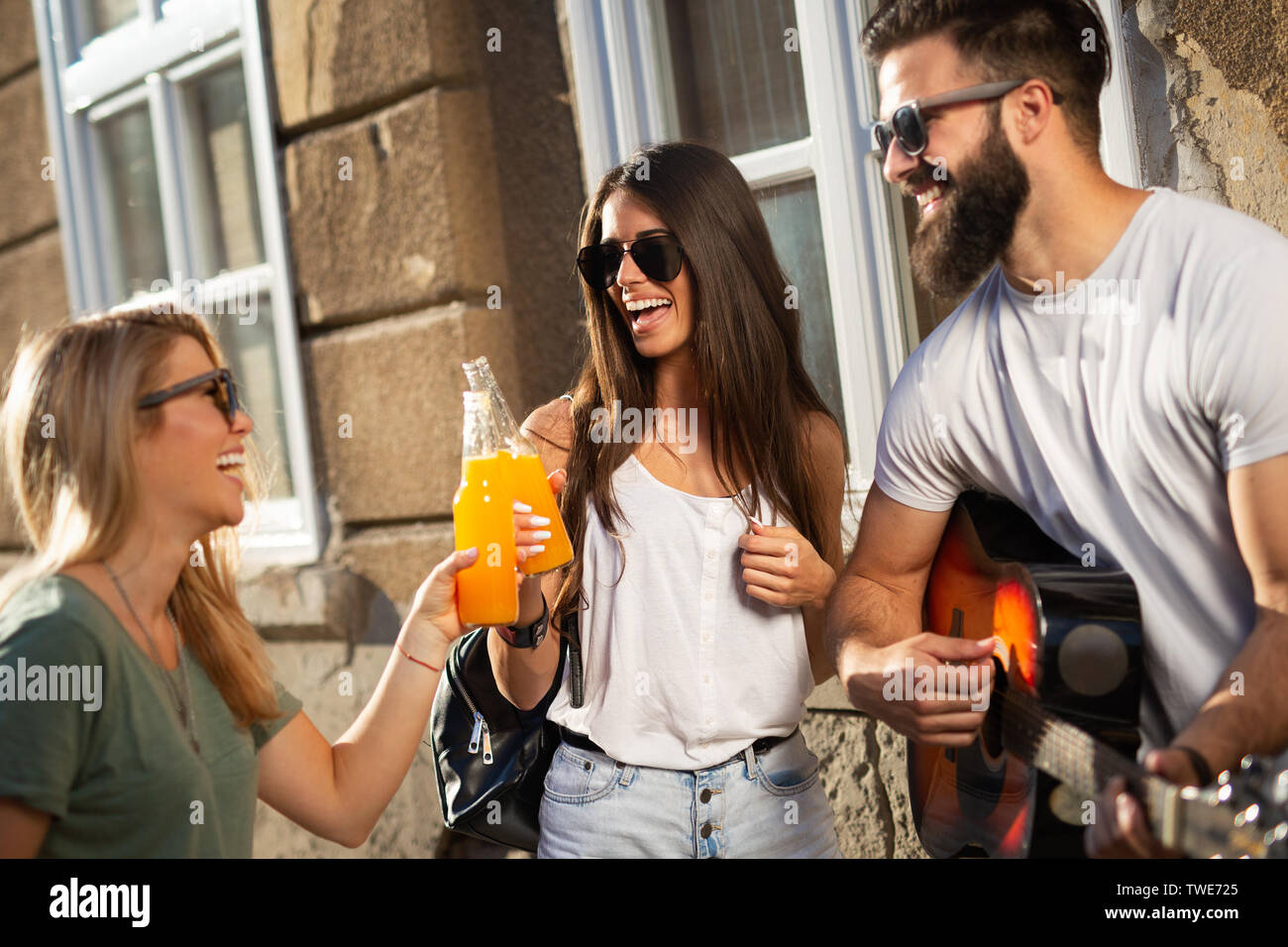 Group of friends hanging out, having fun and enjoying summer days Stock ...