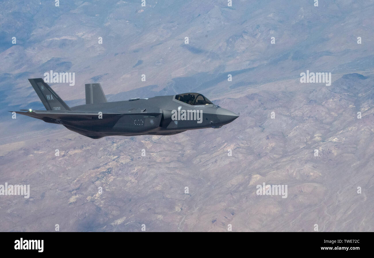 An F-35 Lightning II fighter jet flies in formation over the Nevada ...