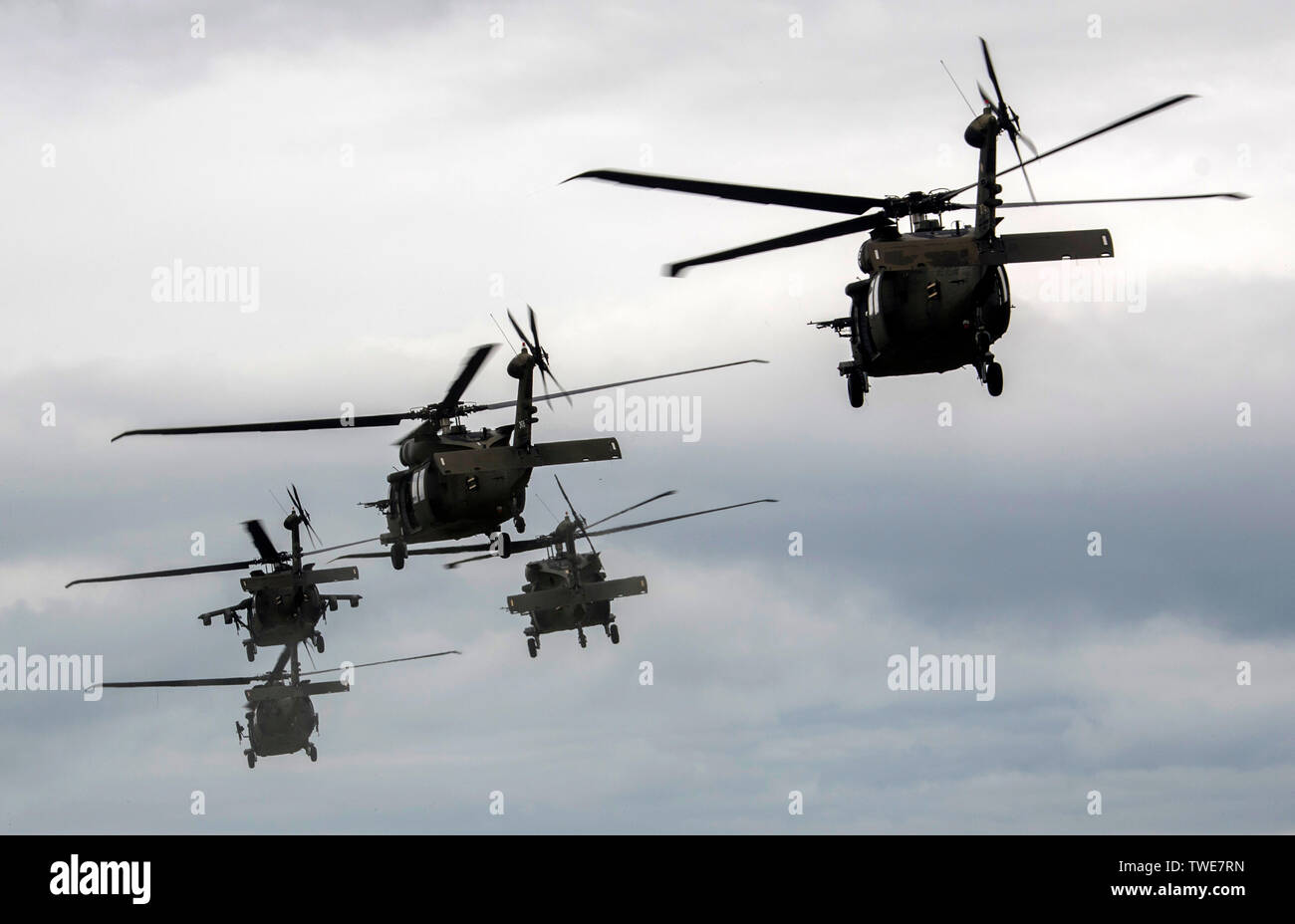 U.S. Army Blackhawk helicopters prepare to maneuver into a tactical ...