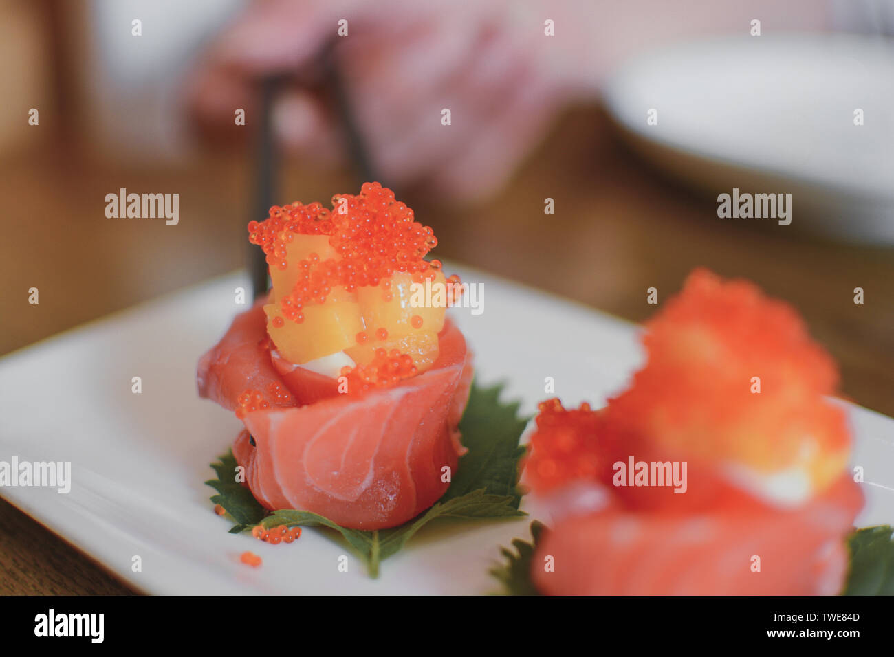 Salmon mango crab seed roll Stock Photo - Alamy
