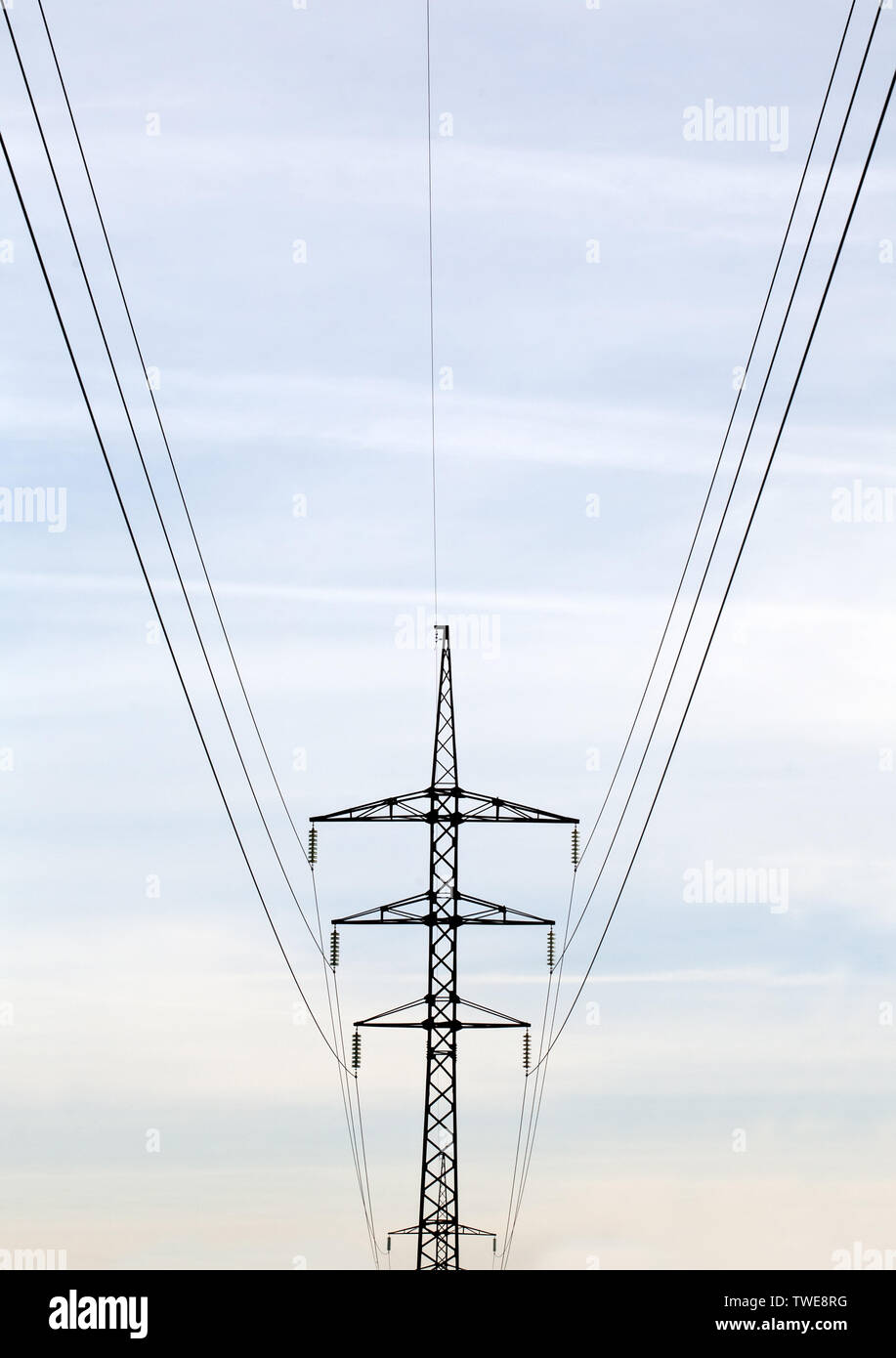 power line pole with cables and wire black silhouette on blue sky ...