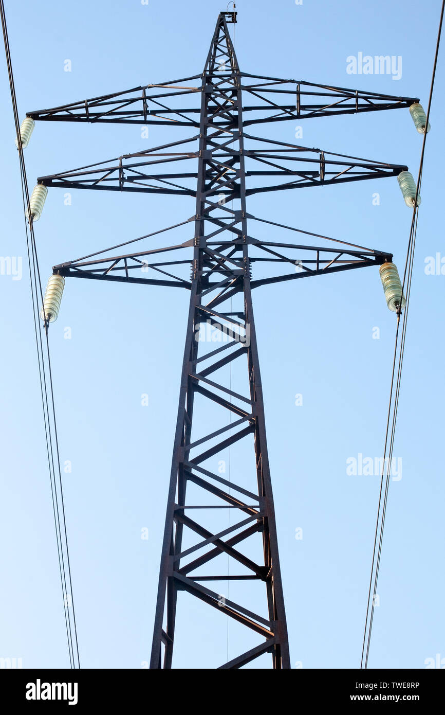 power line pole with cables and wire black silhouette on blue sky ...