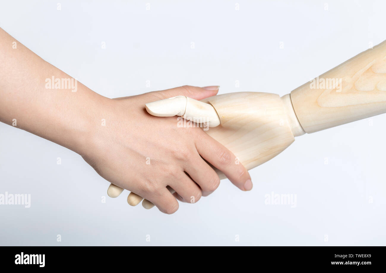 Artificial intelligence hands shake hands with humans close-up Stock ...