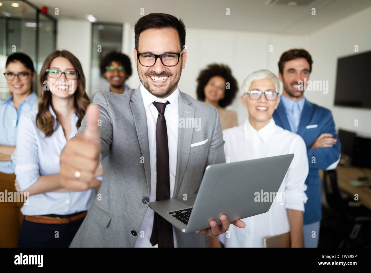 Business team celebrating a good job in the office Stock Photo - Alamy