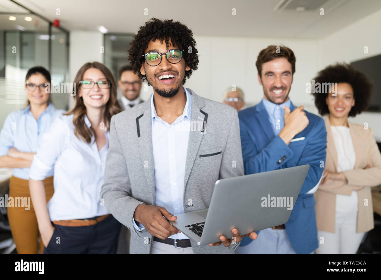 Group of successful business people at work in office Stock Photo - Alamy