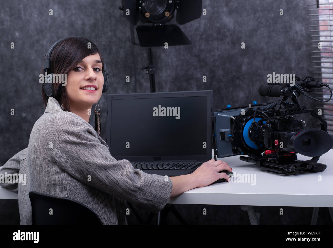 pretty young woman video editor working in studio Stock Photo - Alamy