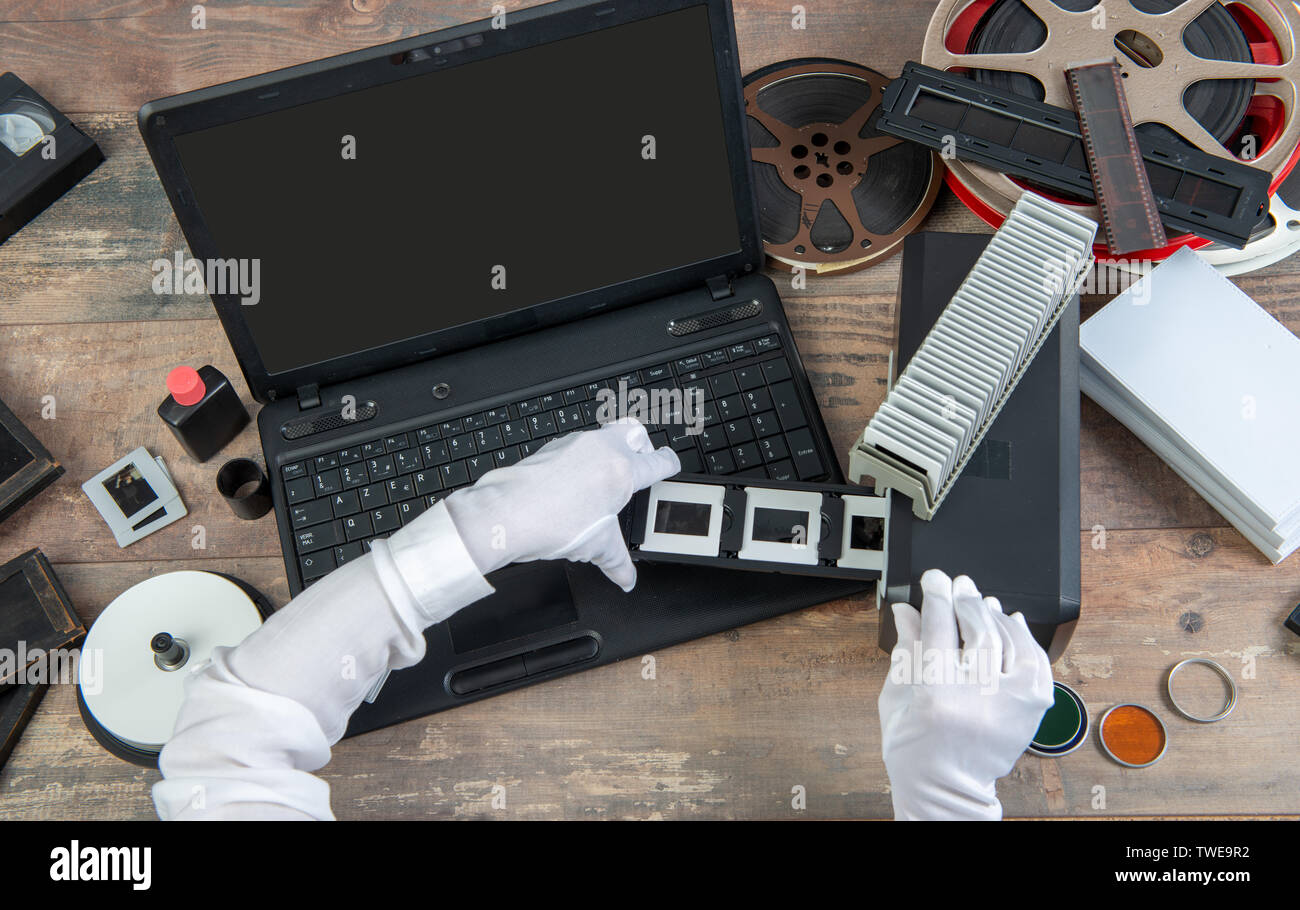 close up hand photographer digitize film slide for saving Stock Photo ...