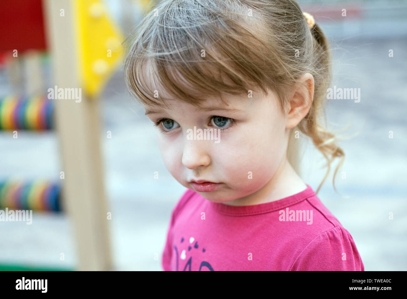white child girl face closeup portrait on outdoor playground background ...