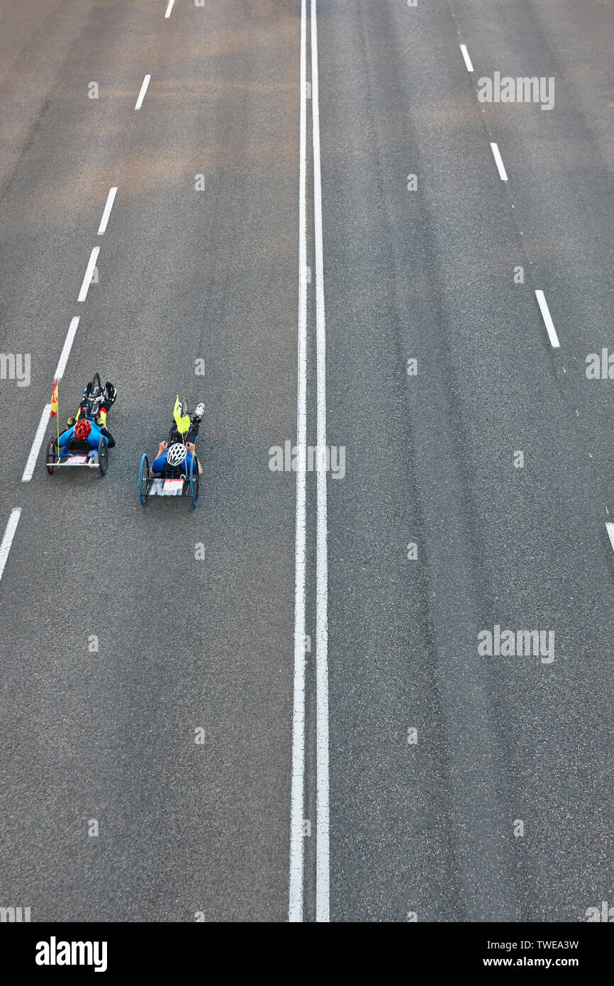 Disabled bike riders on the street. Urban mobility. Sport activity ...