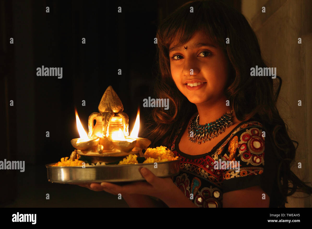Portrait of a girl celebrating diwali Stock Photo - Alamy