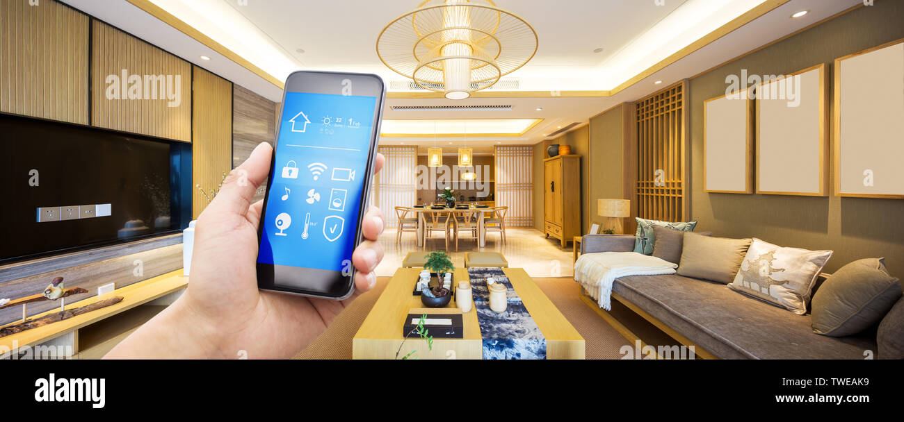 smart phone with smart home with modern living room Stock Photo - Alamy