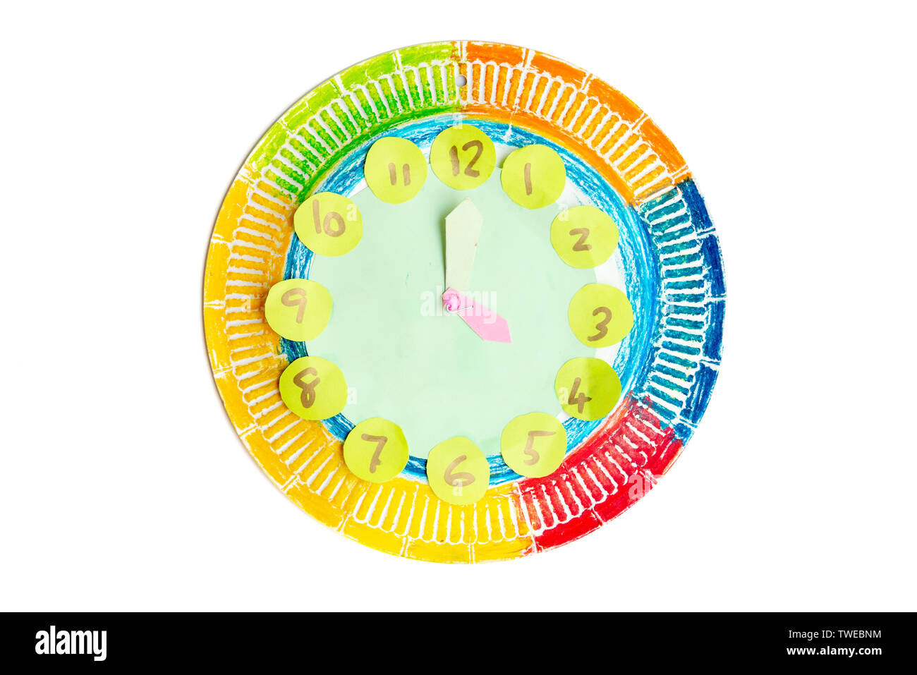Colorful child handwork clock pointing at 4 o'clock, isolated on white ...