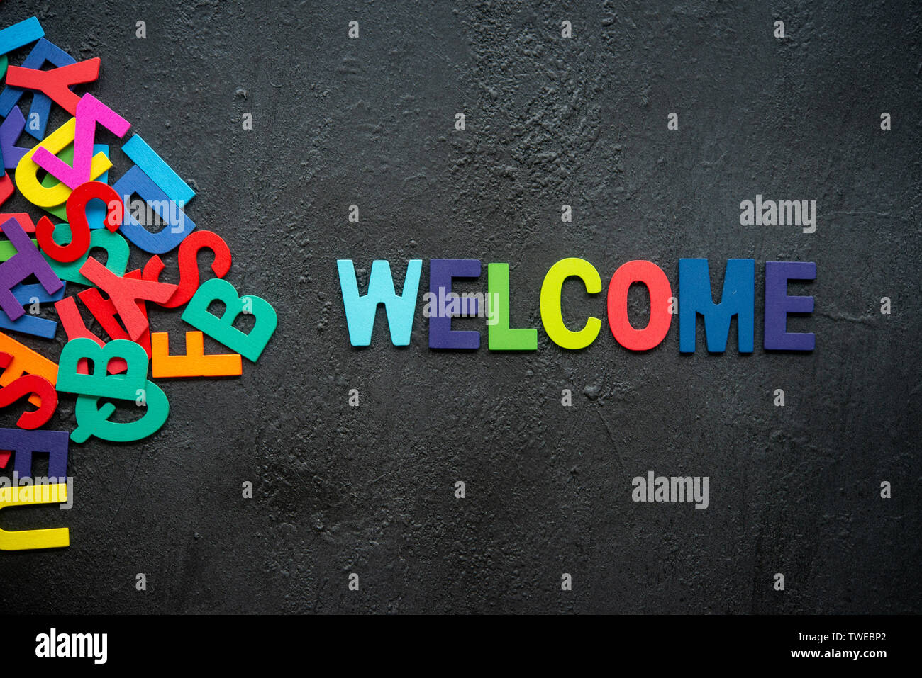 Welcome text on dark background Stock Photo - Alamy