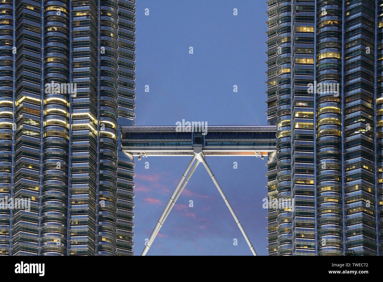 Low angle view of a bridge connecting two towers, Petronas Twin Towers ...