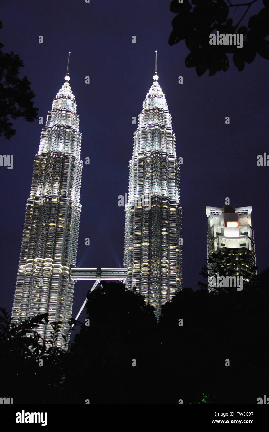Skyscrapers lit up at night, Petronas Twin Towers, Kuala Lumpur ...