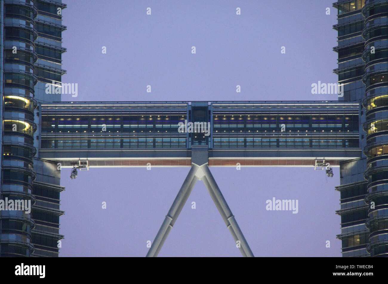 Low angle view of a bridge connecting two towers, Petronas Twin Towers ...