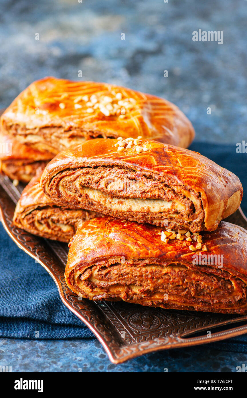 Traditional turkish pastry roll with chocolate and nuts filling ...