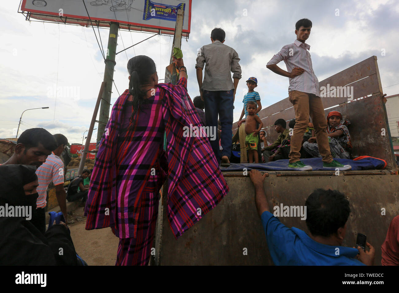 Homebound People traveling on a truck, defying all the dangers and ...