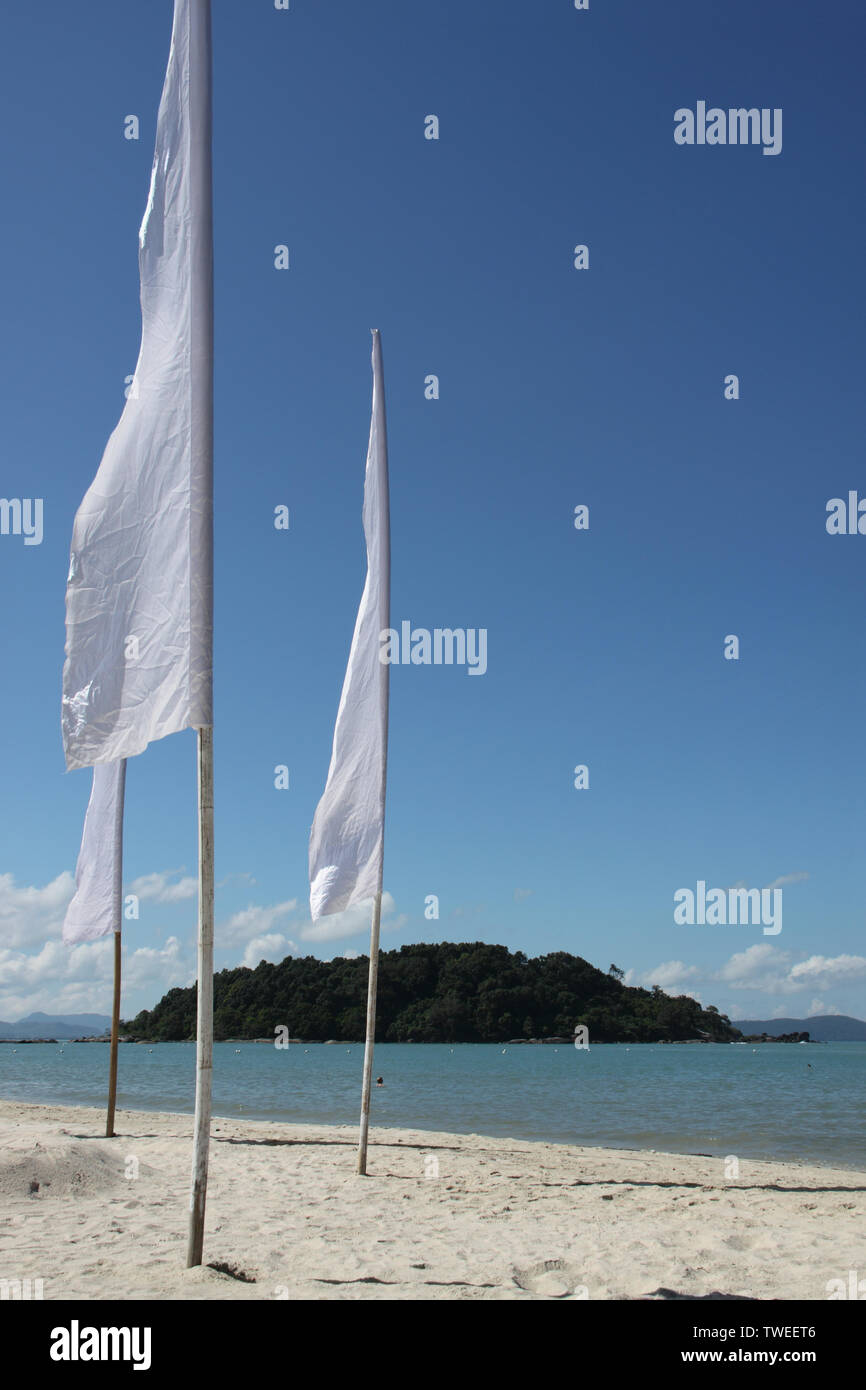 White flags on the beach, Langkawi Island, Malaysia Stock Photo - Alamy