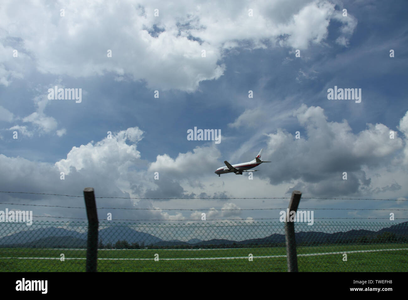 Low angle view of an airplane in flight, Malaysia Stock Photo - Alamy