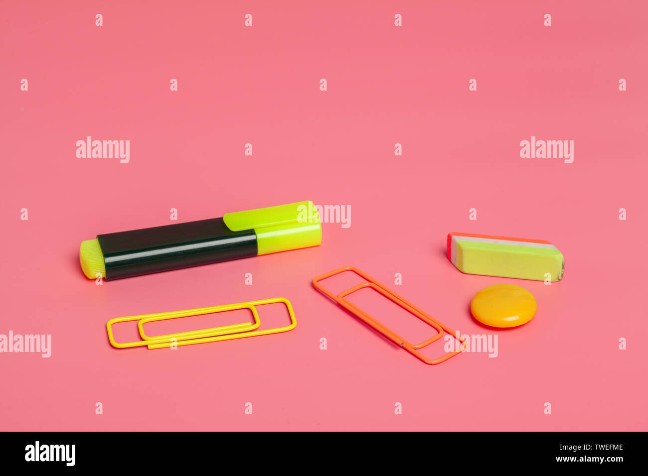 Office clips on bright pink background Stock Photo - Alamy